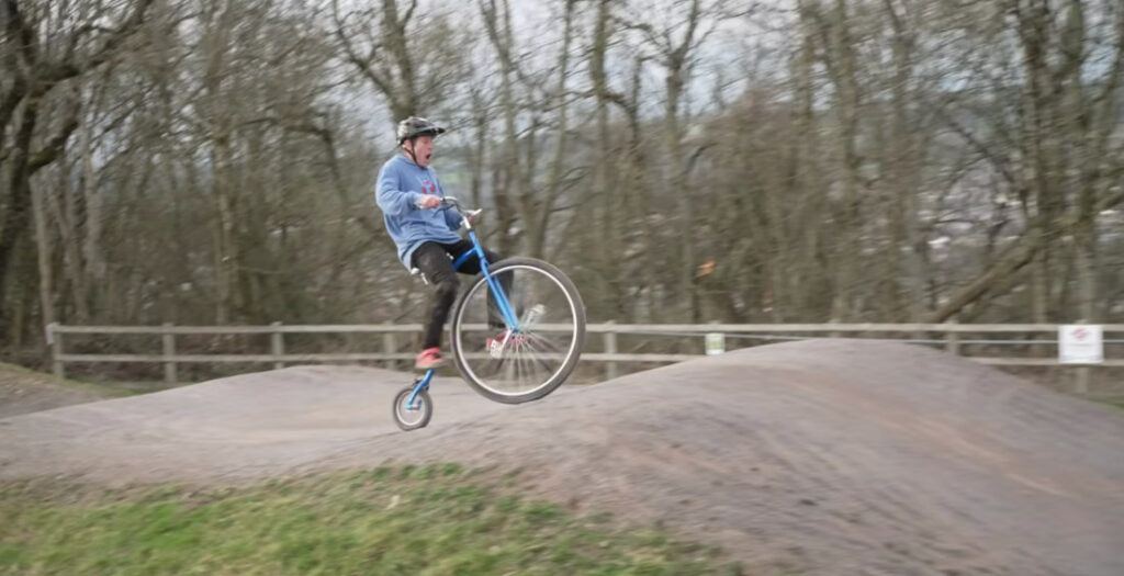 Guy Rides Penny Farthing Bike On Downhill Trail, BMX Track - borninspace
